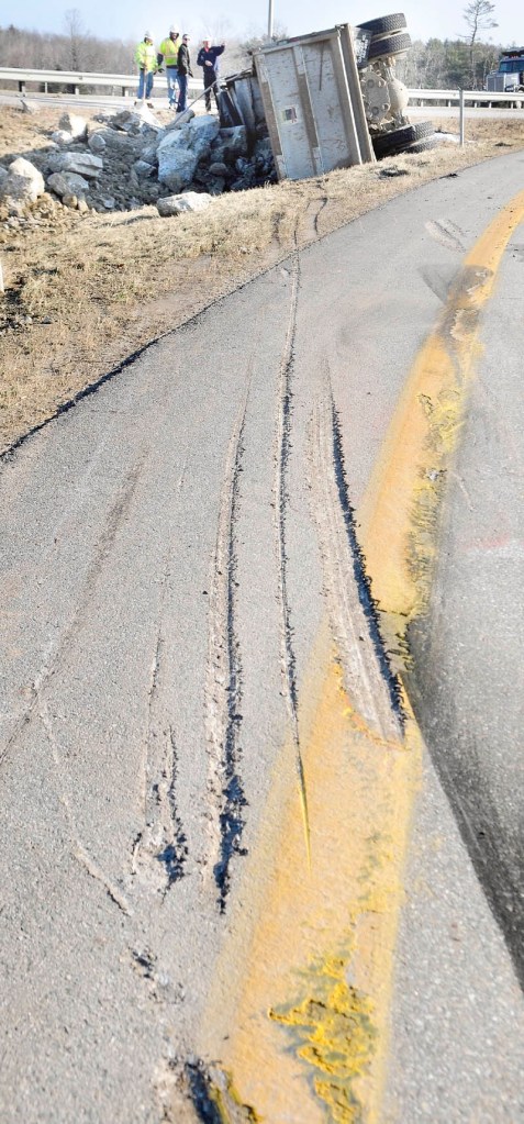 Truck on interstate tips over on off-ramp