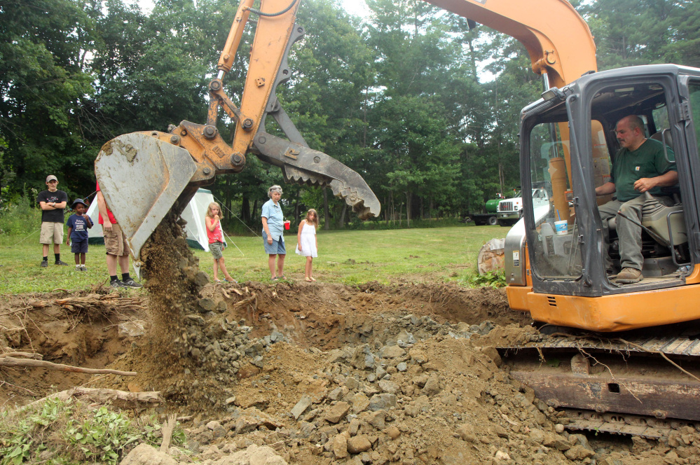 Digging up pottery clay by the ton in Wayne backyard