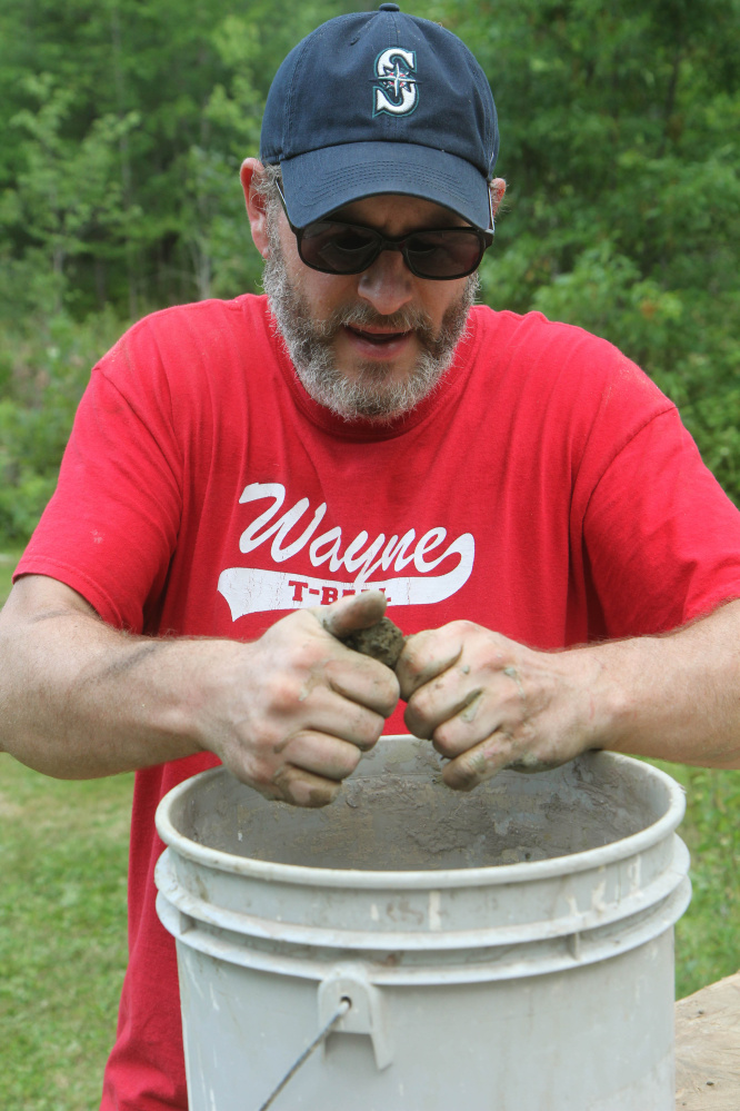 Digging up pottery clay by the ton in Wayne backyard