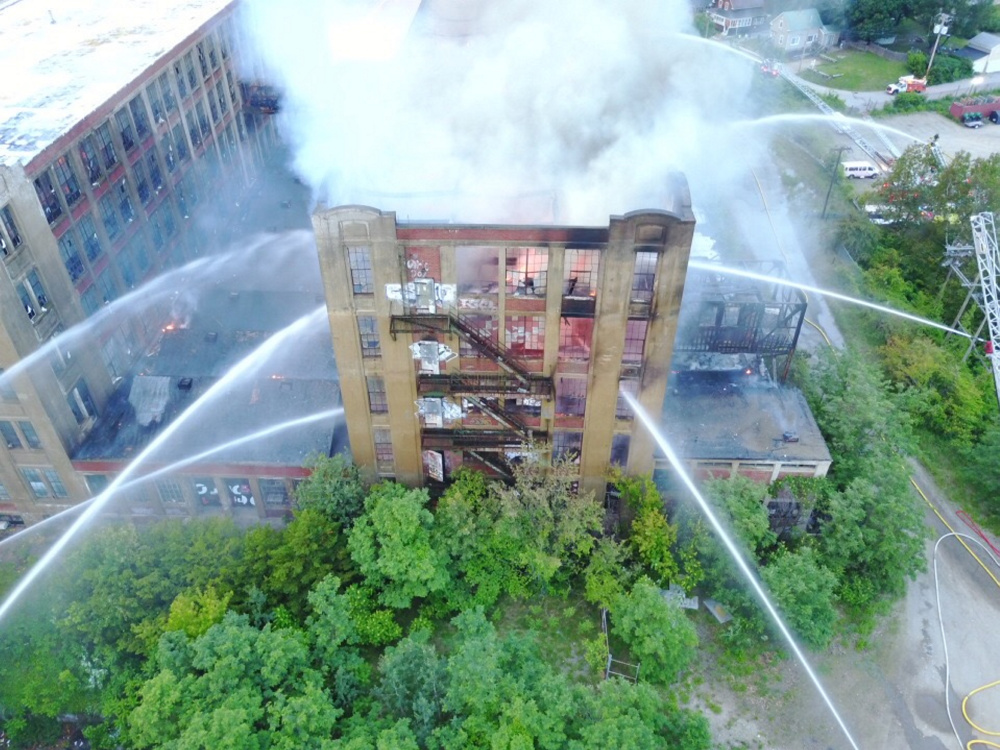 More than 100 firefighters battle flames that engulf Sanford mill